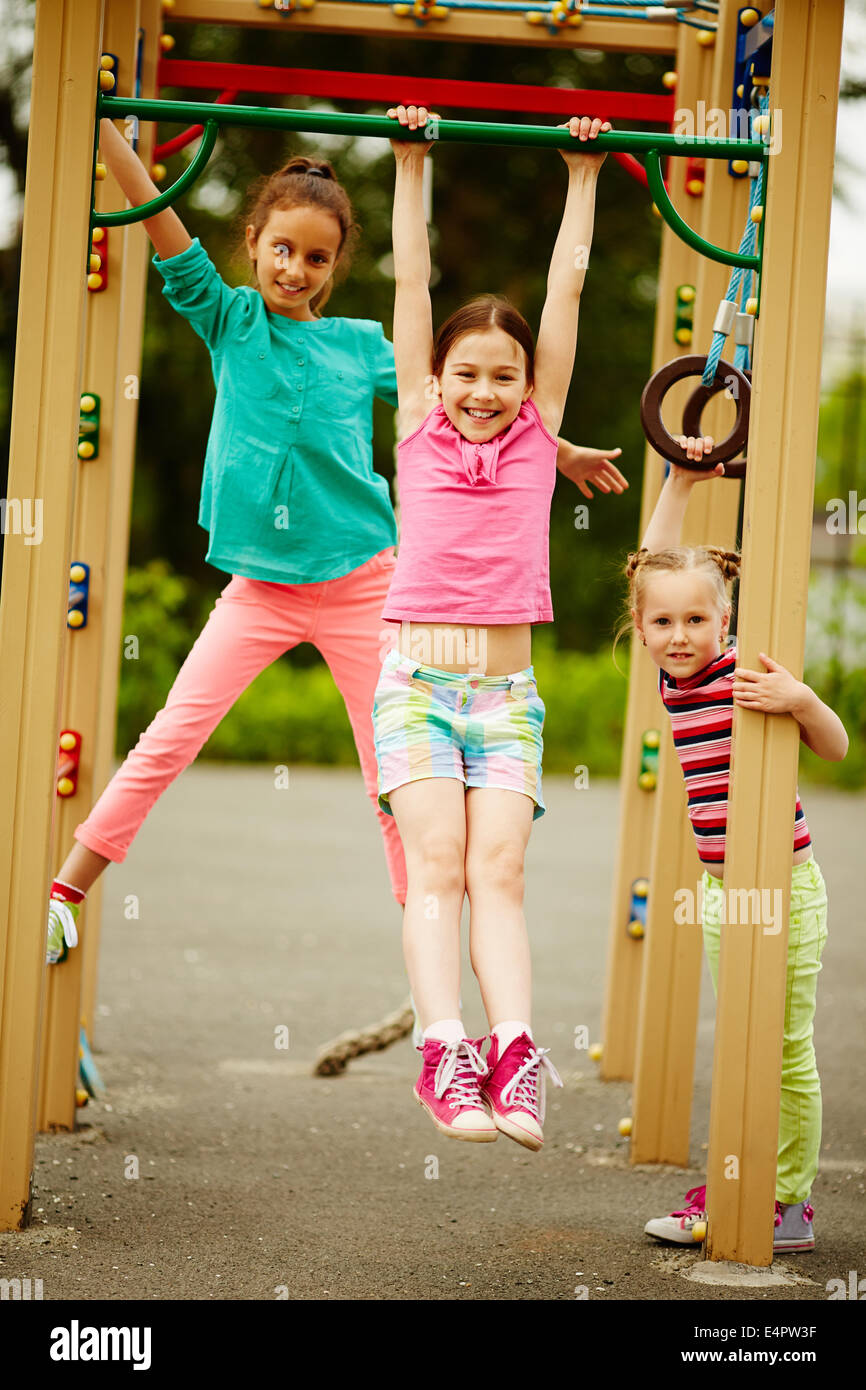 Happy little girls looking at camera on playground area Stock Photo ...