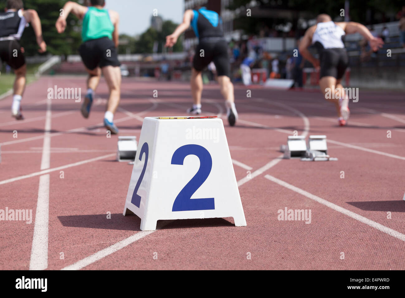 athletes starting a race Stock Photo - Alamy