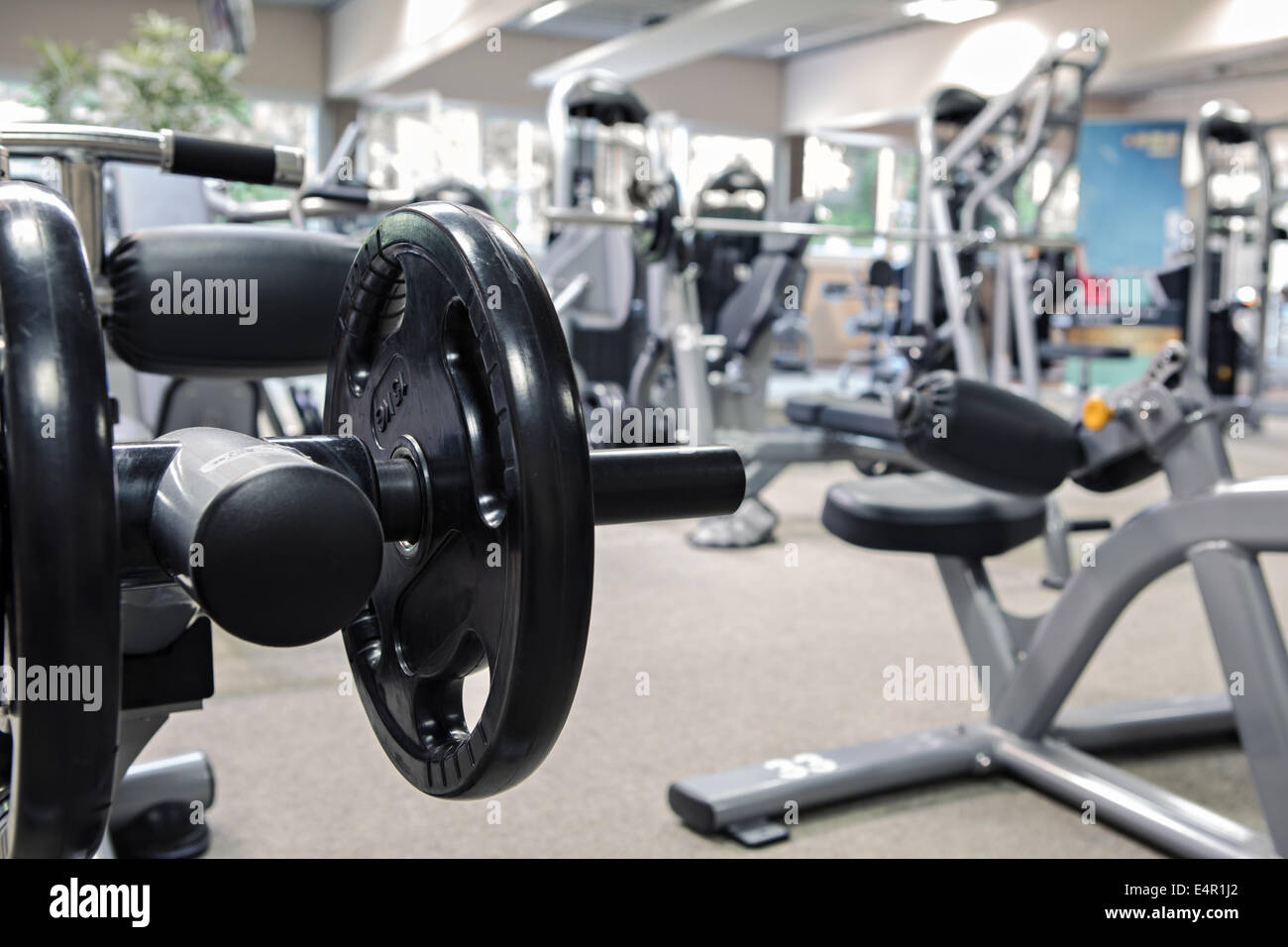 diverse equipment and machines at the gym room Stock Photo - Alamy