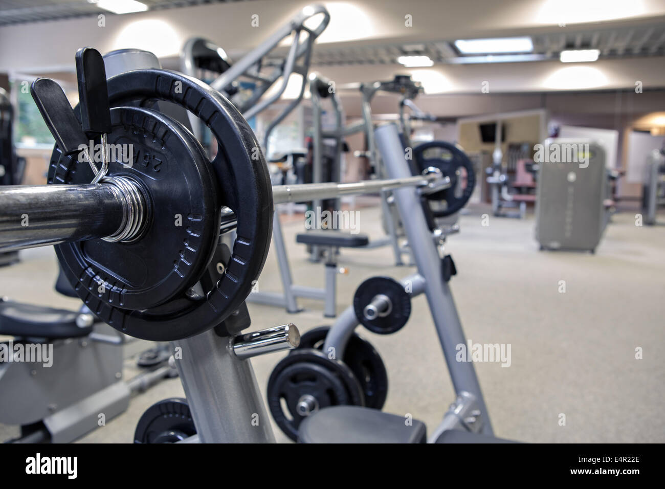diverse equipment and machines at the gym room Stock Photo - Alamy