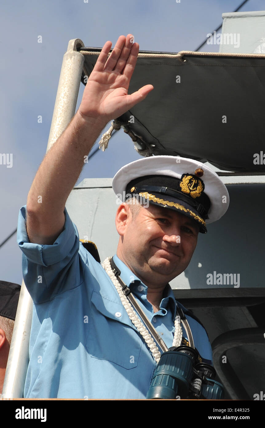Commanding officer Captain Kurt Leonards waves farewell during the ...