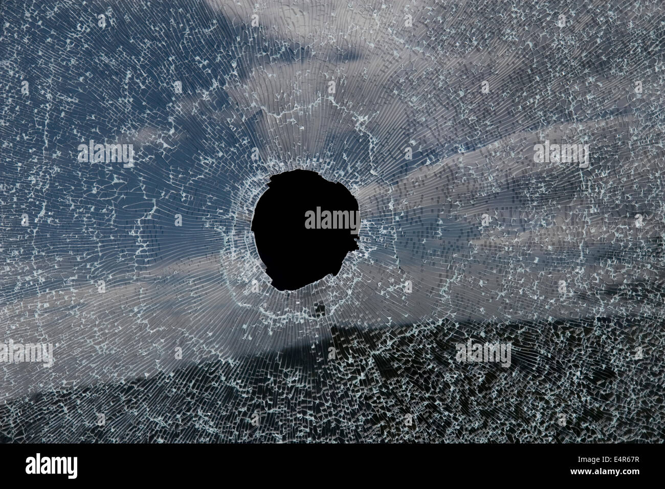 Shattered car windscreen with reflection of sky Stock Photo - Alamy