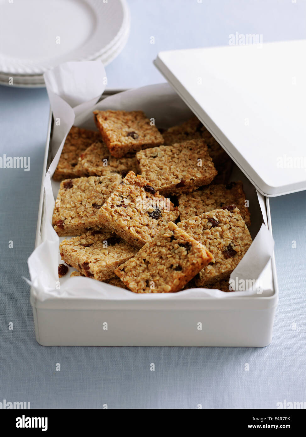 Sultana flapjacks in box lined with paper Stock Photo - Alamy