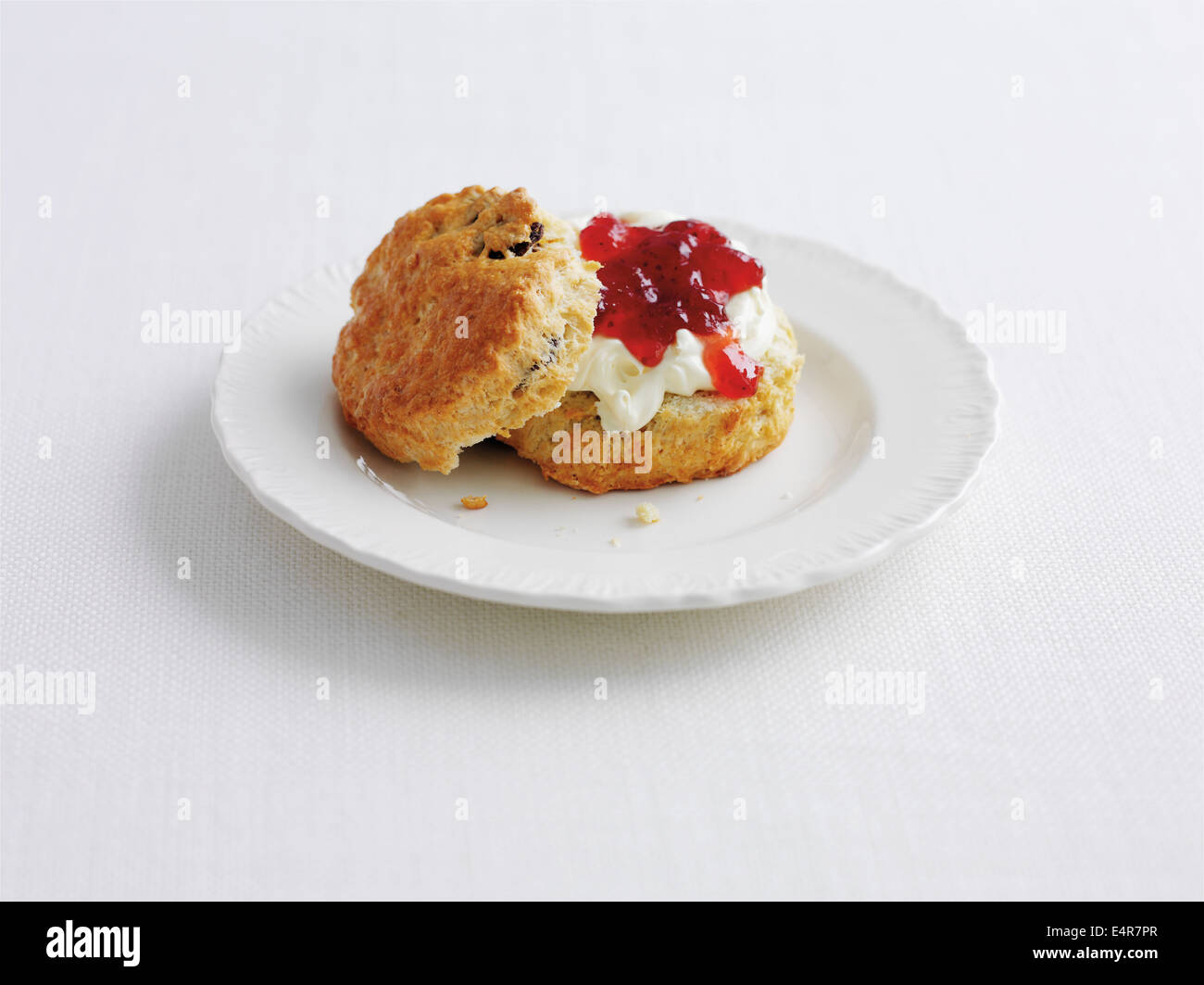 Scone with jam and clotted cream Stock Photo - Alamy