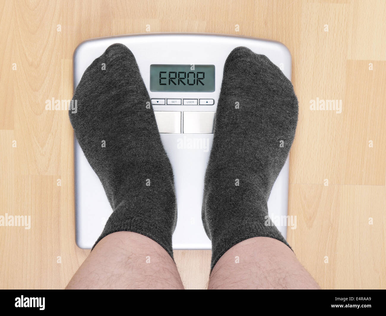Fat man on scale hi-res stock photography and images - Alamy