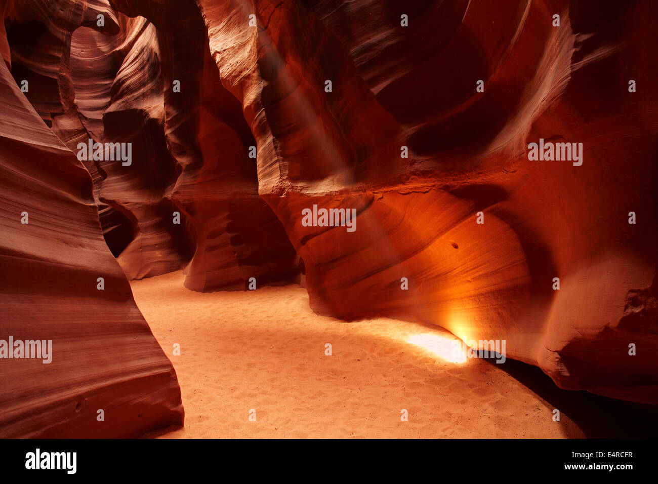 Shaft of light and eroded sandstone formations in Upper Antelope Canyon ...