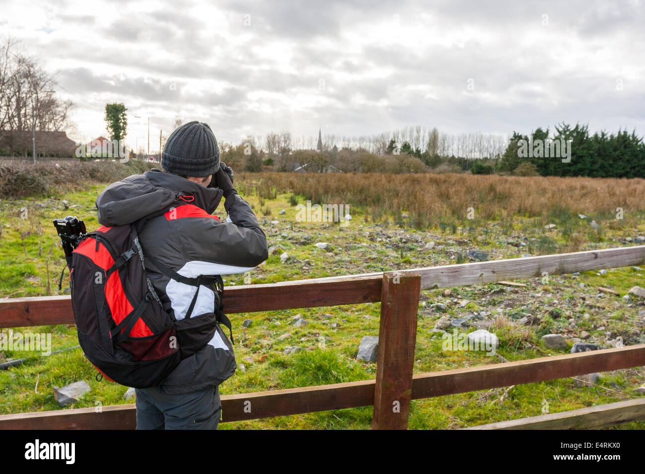 Back view of photographer taking a picture Stock Photo - Alamy