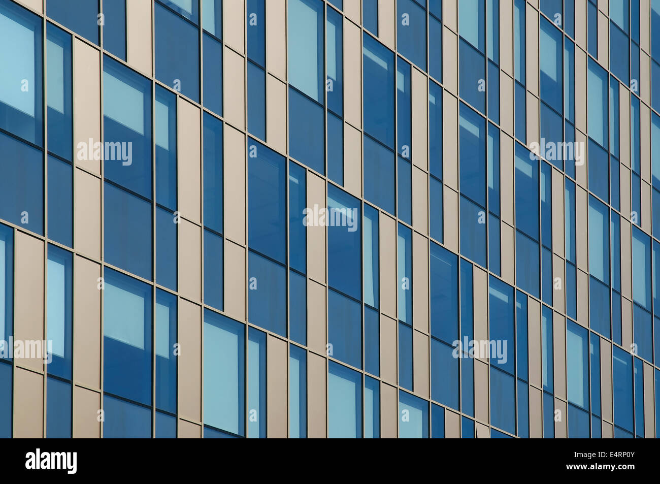 Glass building with golden stripes Stock Photo - Alamy