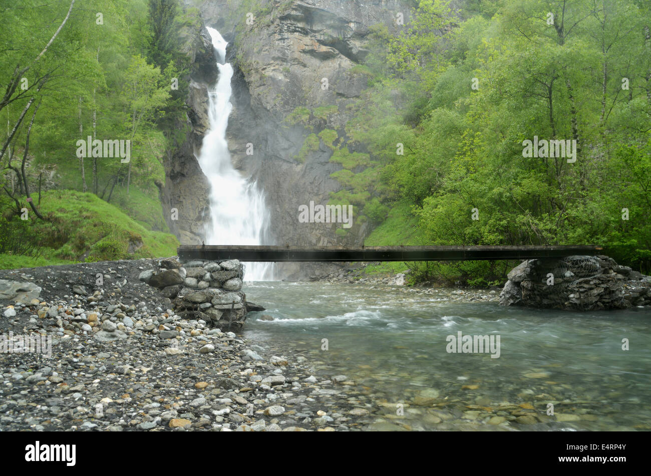 Waterfall splashes into a pool Stock Photo - Alamy