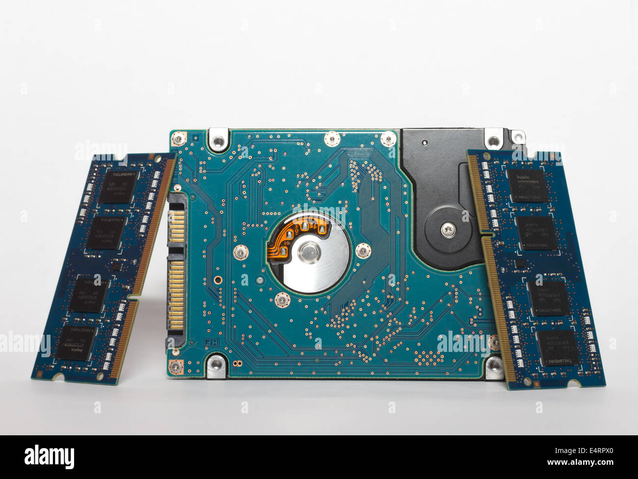 This image shows two RAM modules and a SATA hard drive isolated on a ...