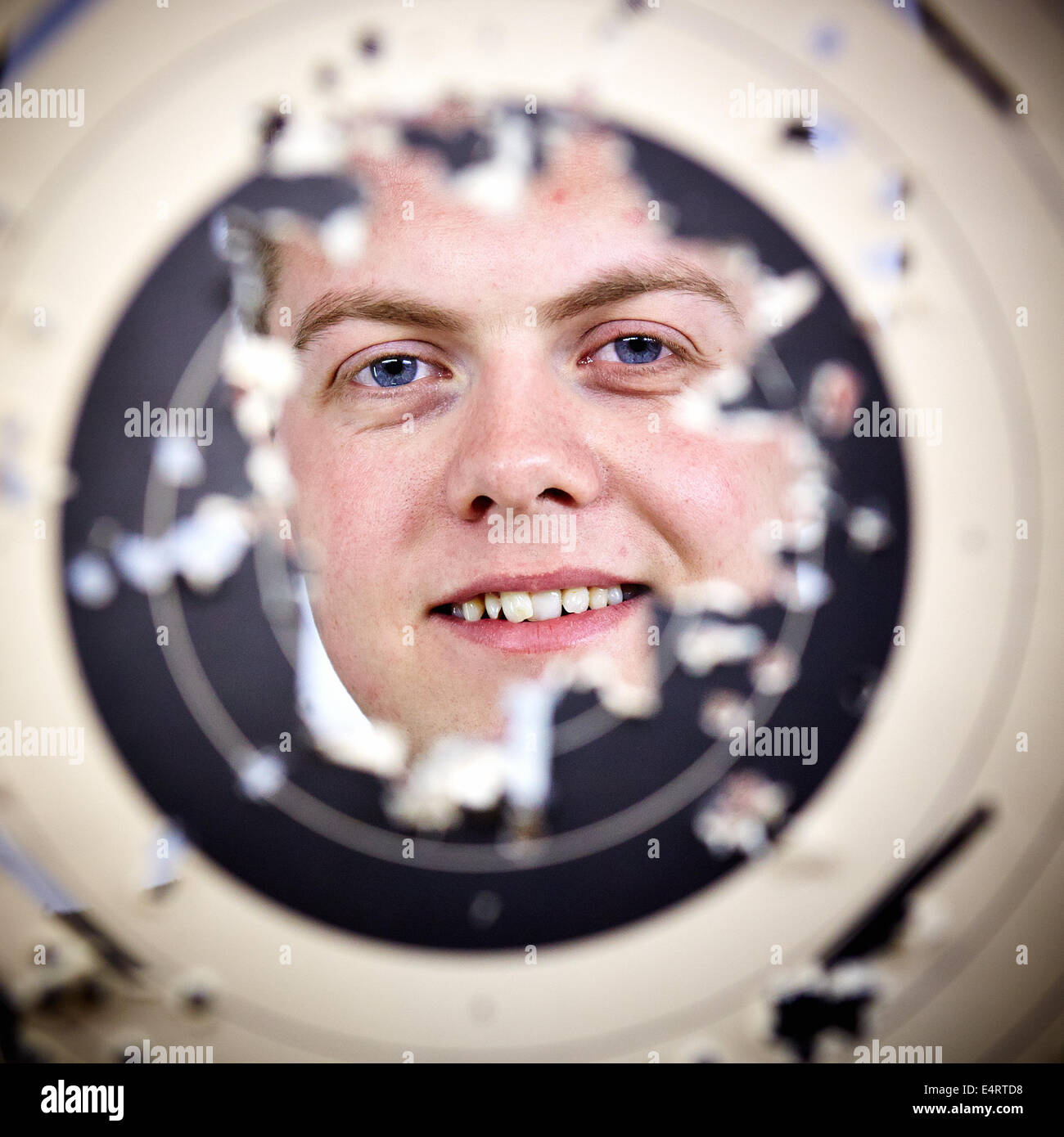 Dan Rivers looks through a used paper target at the Wantage Target ...