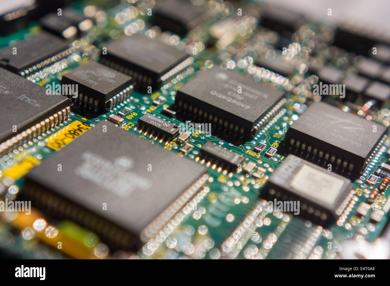 A circuit board resembles a city map, from a circa 1992 hard drive seen ...