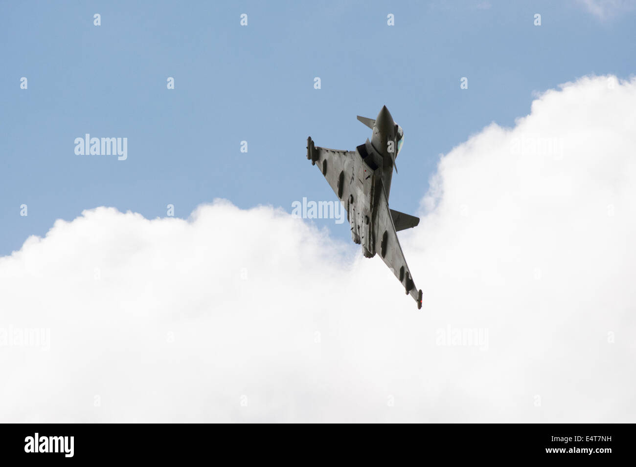 Eurofighter Typhoon flying in blue sky with white fluffy clouds Stock ...