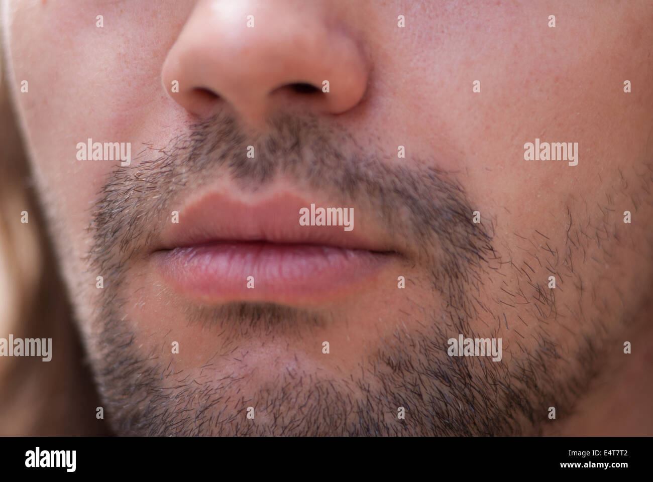 Part of face young European man with beard Stock Photo - Alamy