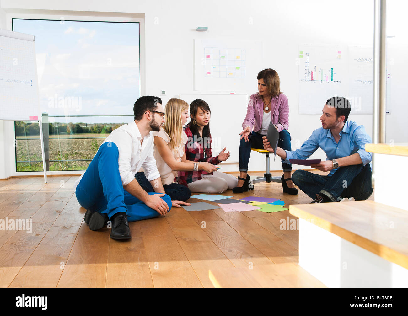 Five People Sitting On Other High Resolution Stock Photography and ...