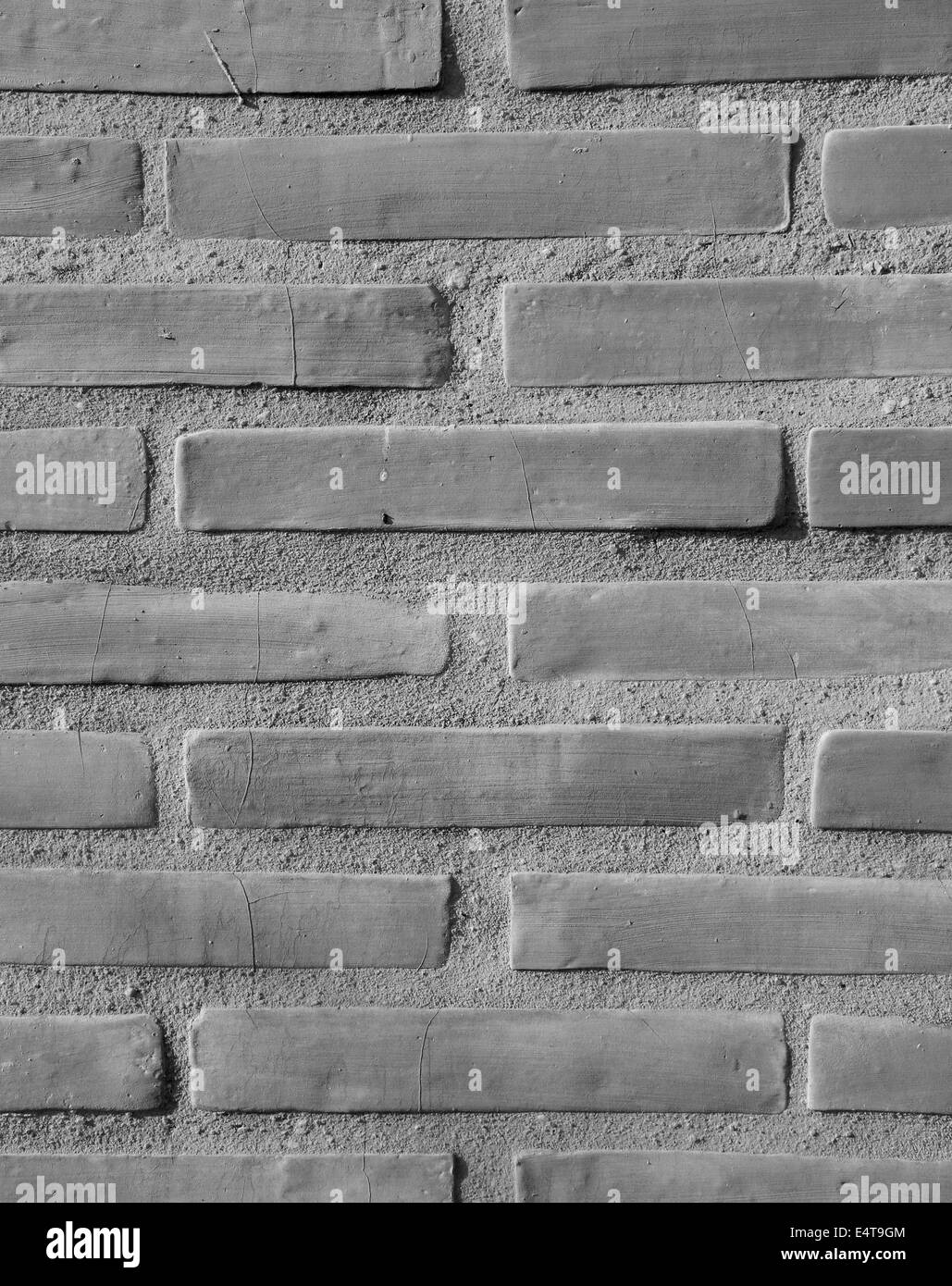 Brick-encased wall - background in black and white Stock Photo - Alamy