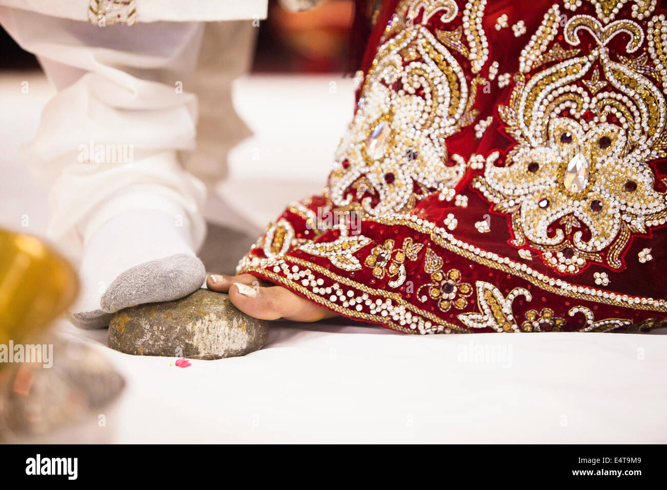 Bride and Groom Stepping on Stone during Hindu Wedding Ceremony ...