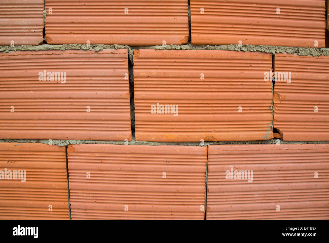 Red clay bricks attached by concrete. Background Stock Photo - Alamy