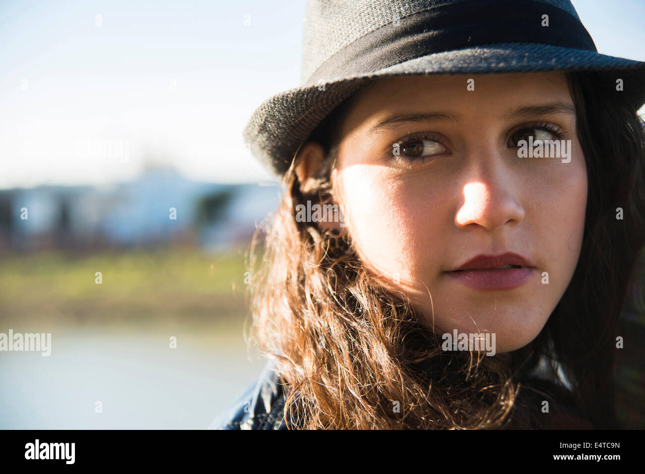 Close-up portrait of teenage girl wearing fedora, Germany Stock Photo ...