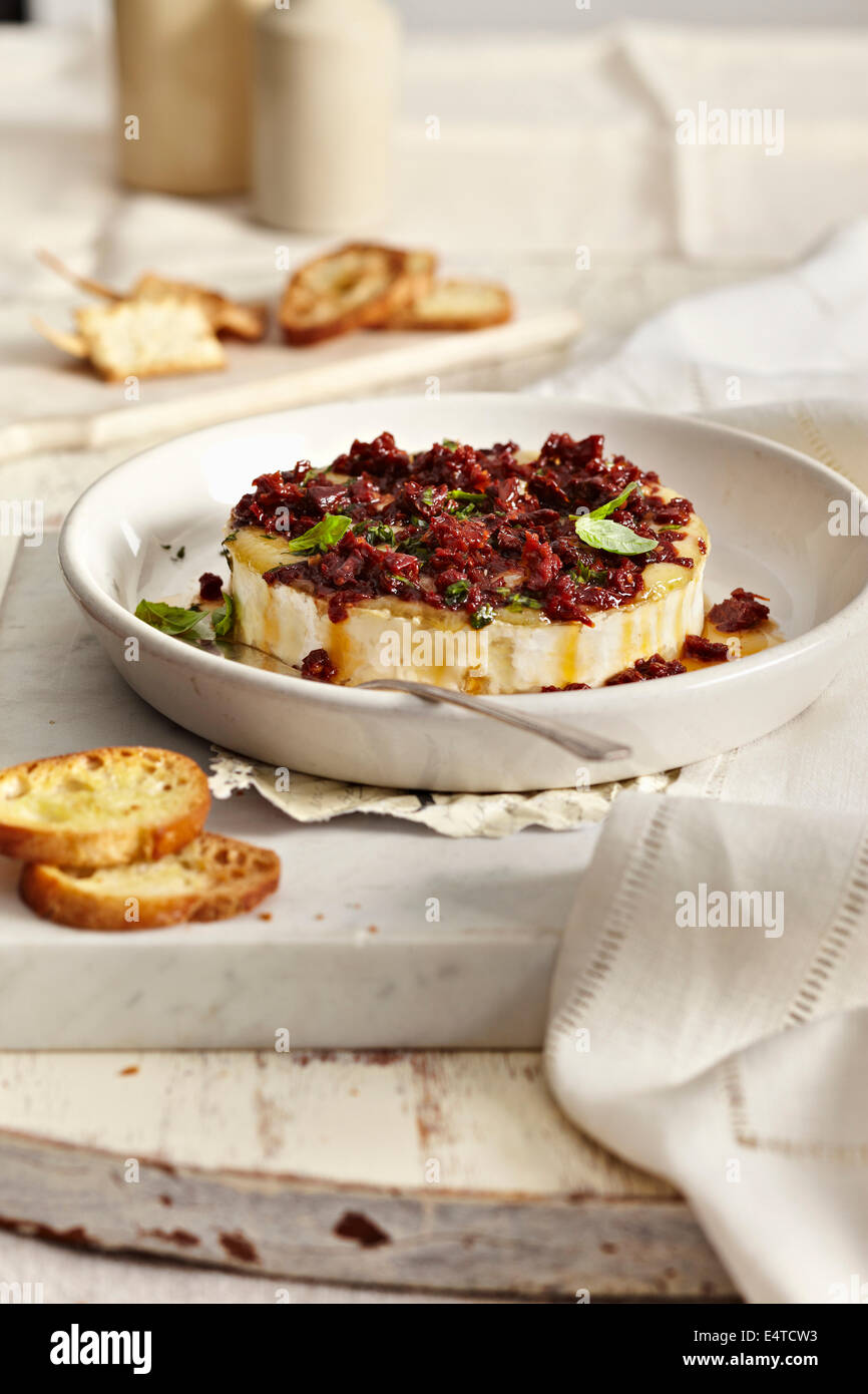 Brie Cheese with Slices of Baguette, Studio Shot Stock Photo - Alamy