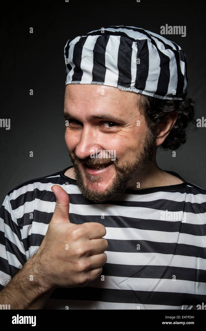 Imprisoned, Desperate, portrait of a man prisoner in prison garb, over ...