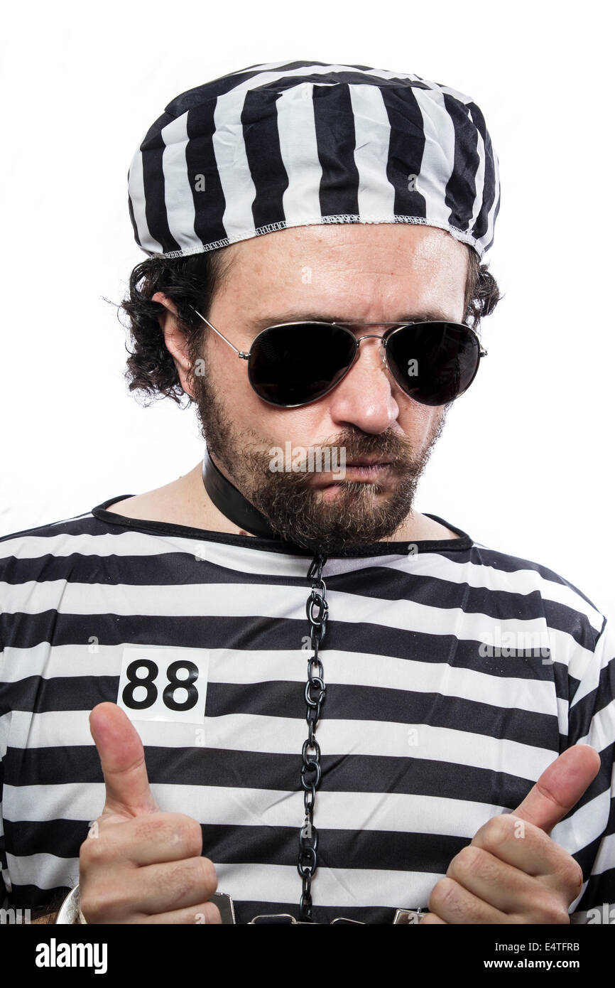 Prison, one caucasian man prisoner criminal with chain ball and ...