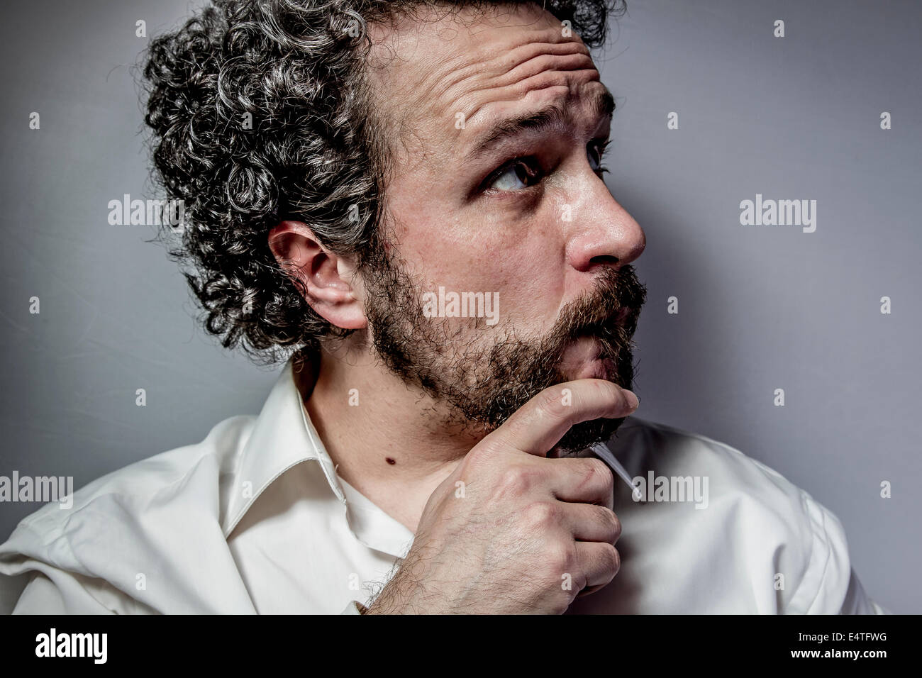 Fear, man with intense expression, white shirt Stock Photo - Alamy