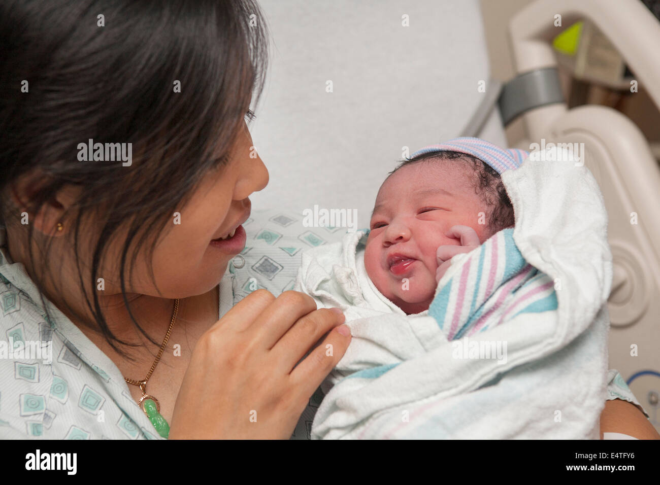 Proud Mother holding Newborn Baby Girl for the First Time Stock Photo ...