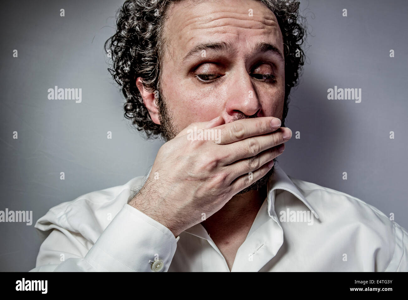 say nothing, silence, man with intense expression, white shirt Stock ...