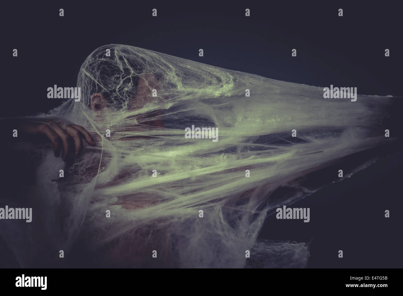 Man trapped in a spider web Stock Photo - Alamy