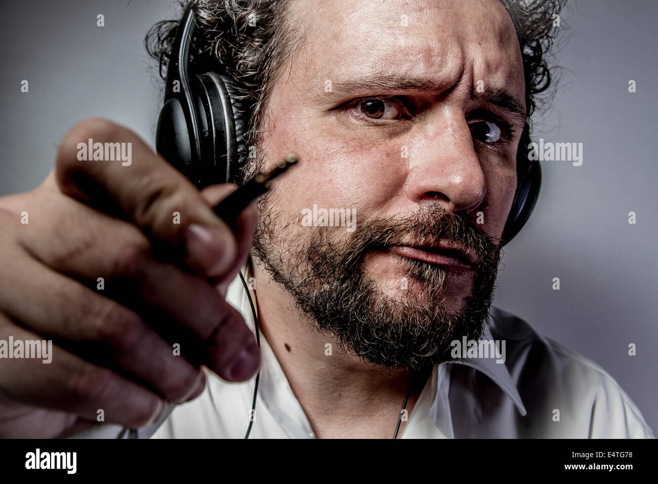 Funny, man with intense expression, white shirt Stock Photo - Alamy