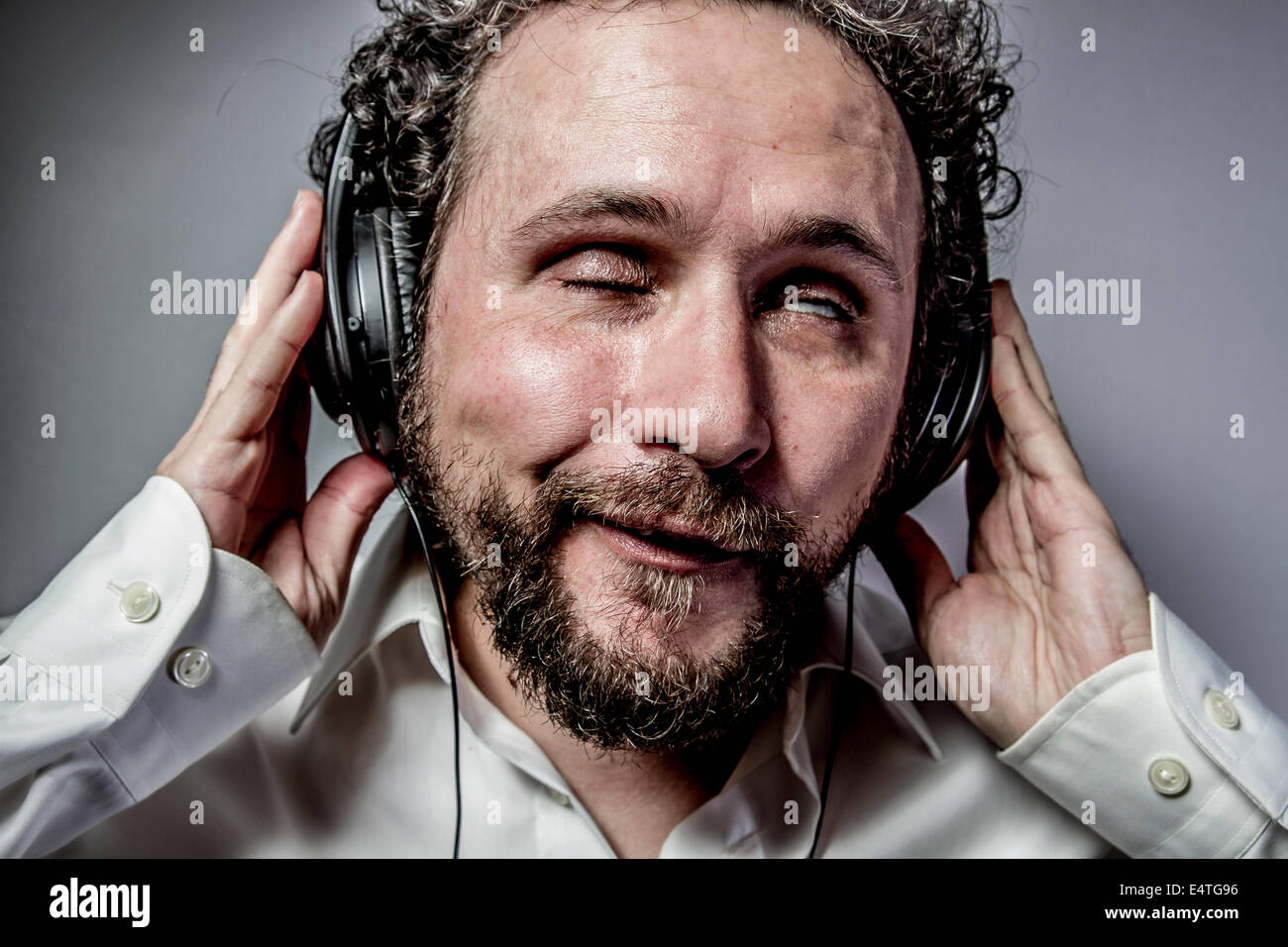 enjoy the music, man with intense expression, white shirt Stock Photo ...