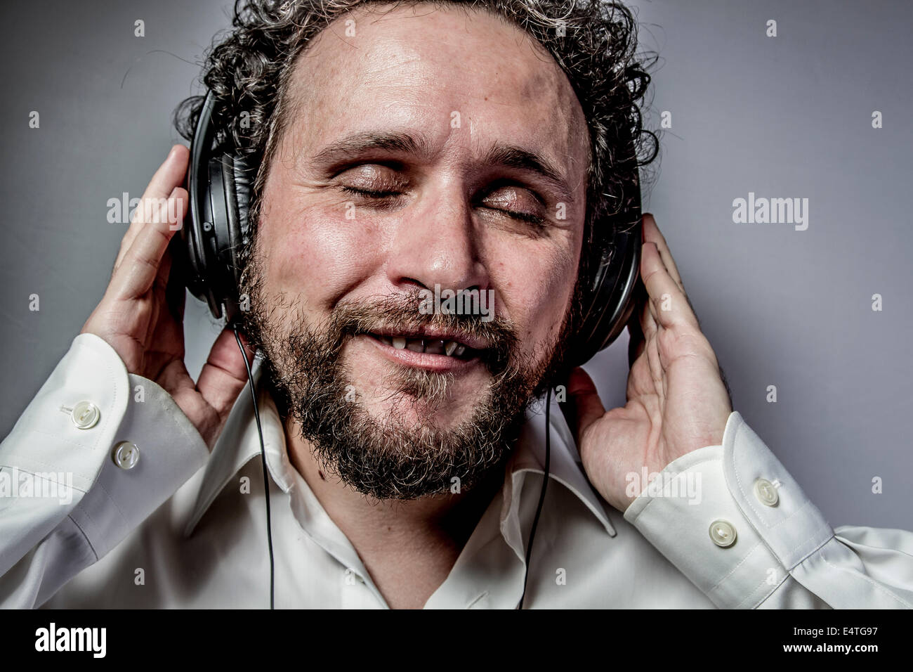 enjoy the music, man with intense expression, white shirt Stock Photo ...