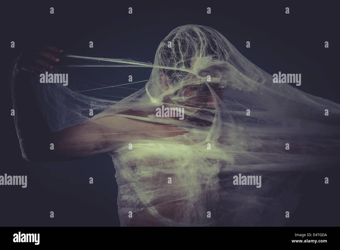 Man trapped in a spider web Stock Photo - Alamy