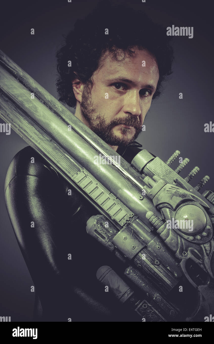 Warrior, Future soldier with huge weapon, sci-fi scene Stock Photo - Alamy