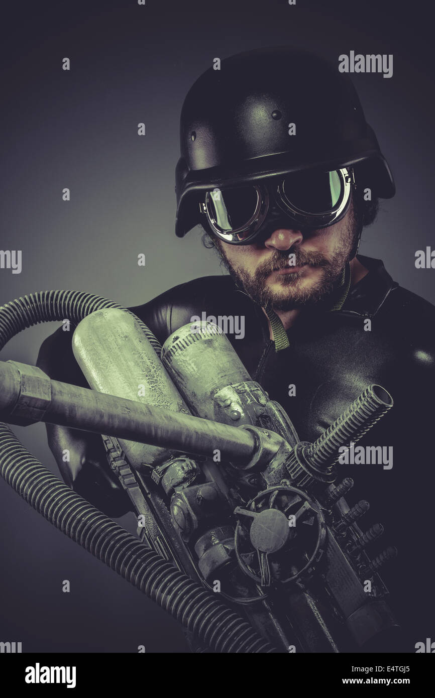 Alien, Future soldier with huge weapon, sci-fi scene Stock Photo - Alamy
