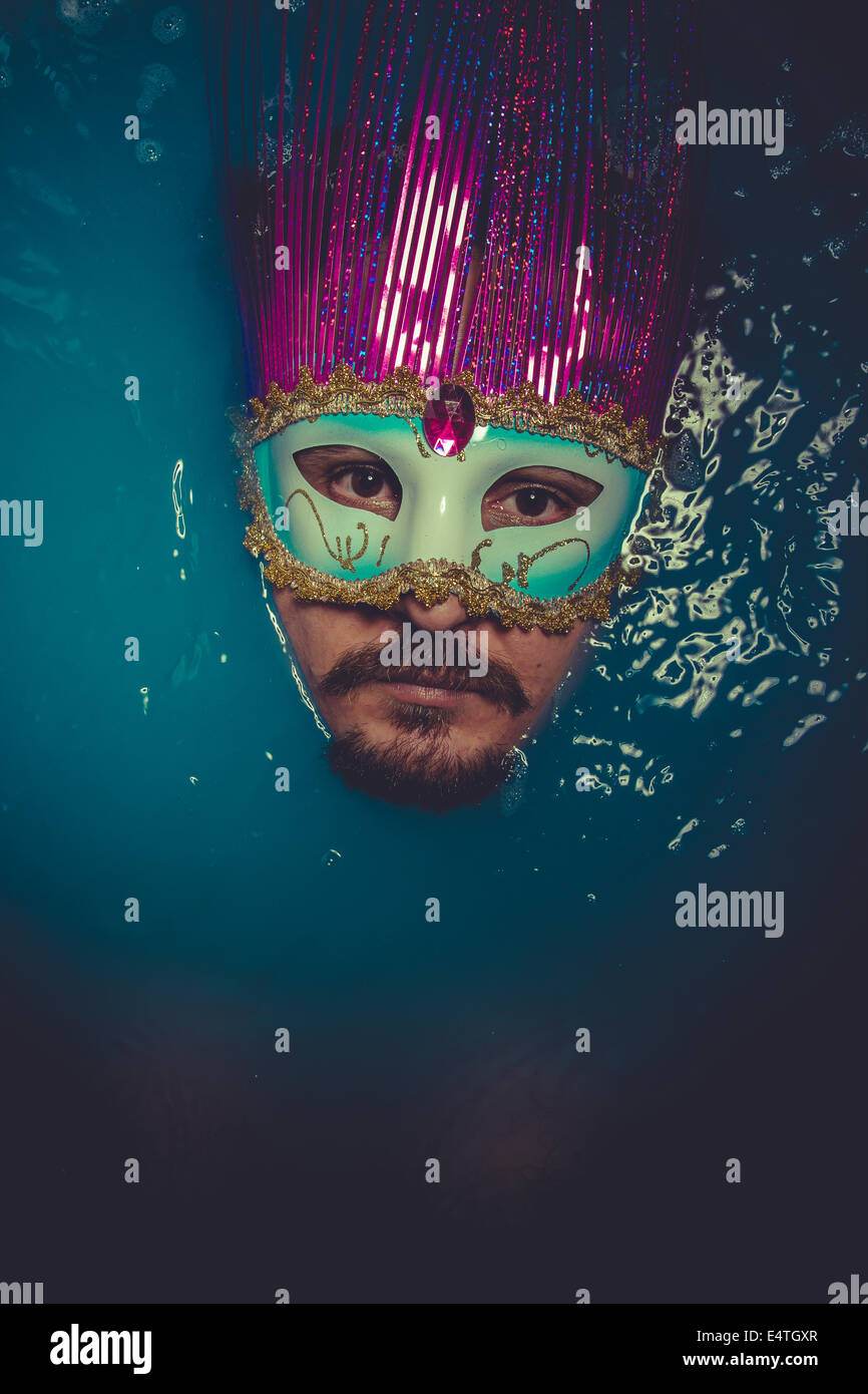 Mask, man immersed in bluewater, concept of depression Stock Photo - Alamy