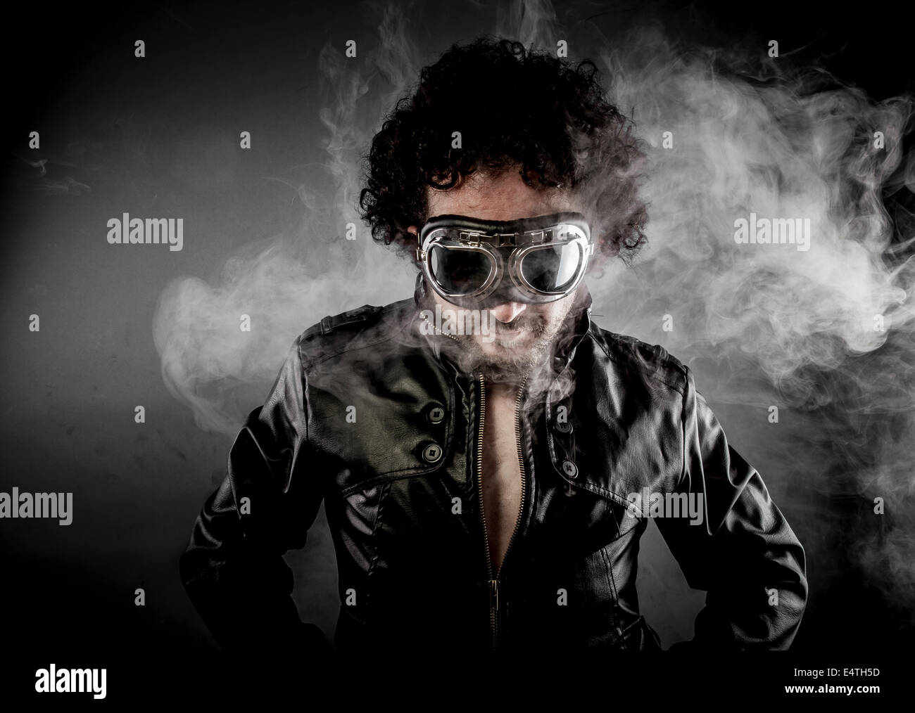 Male biker with sunglasses era dressed Leather jacket, huge smoke over ...