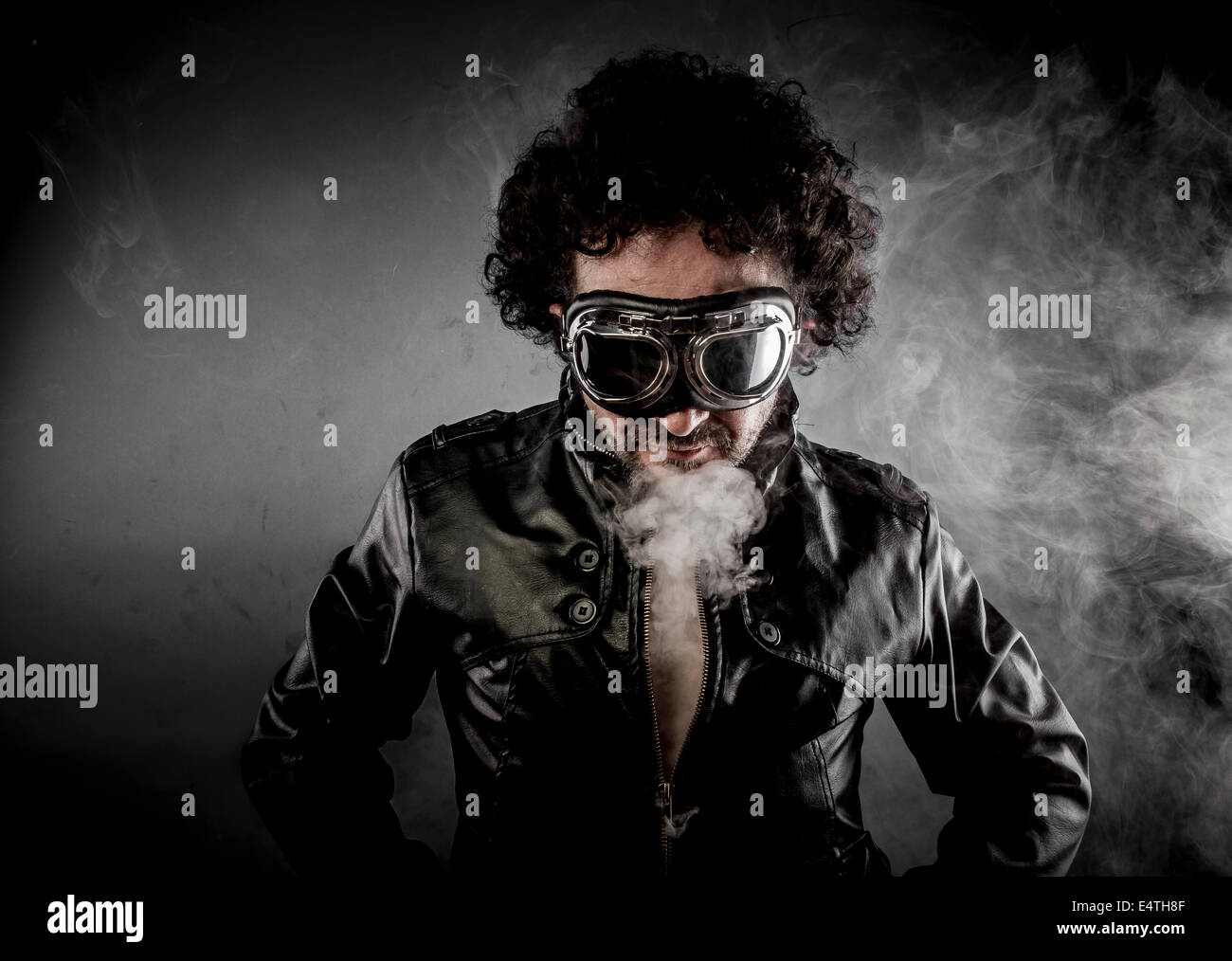 Male biker with sunglasses era dressed Leather jacket, huge smoke over ...