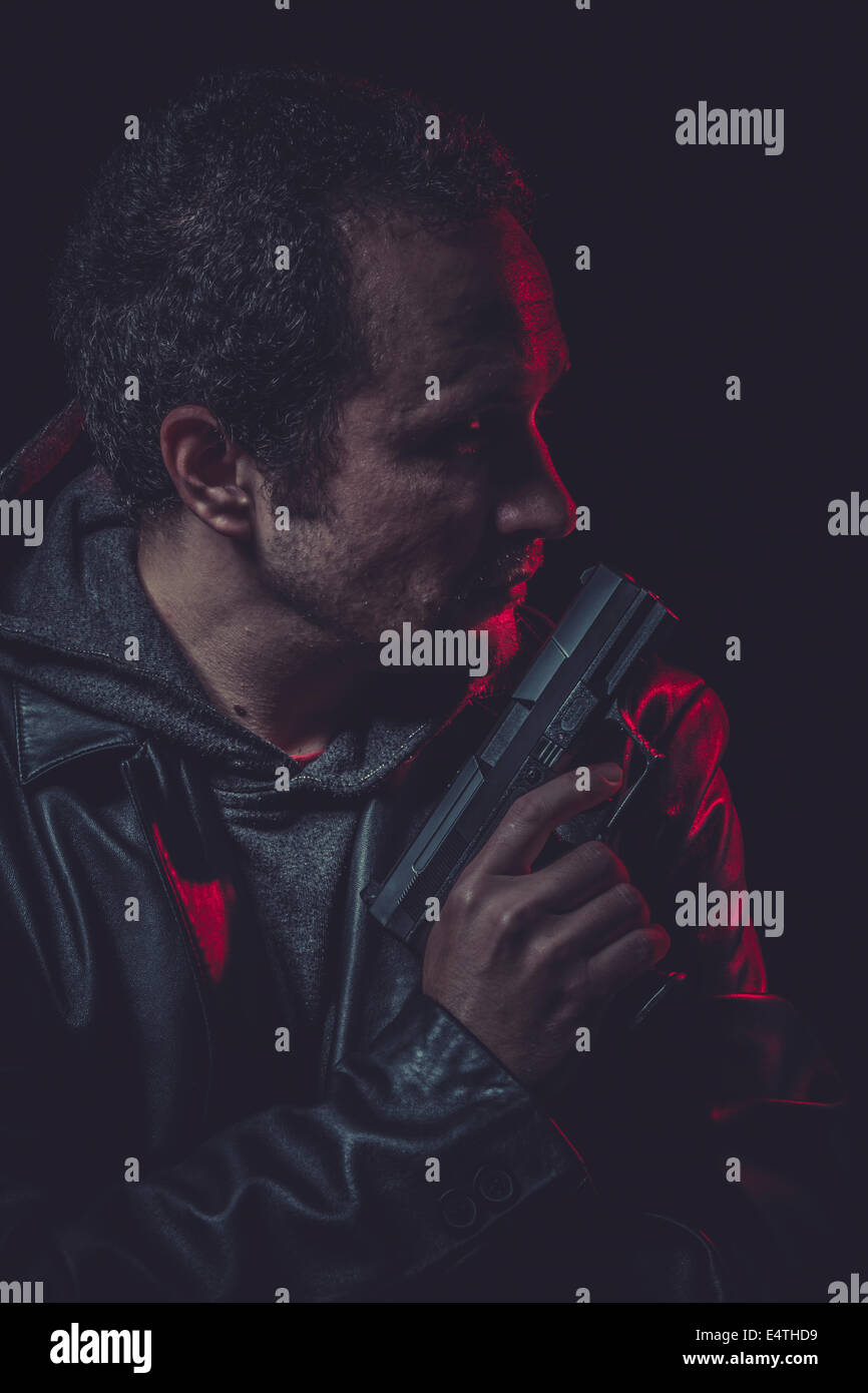 Weapon, secret agent with gun and red light Stock Photo - Alamy