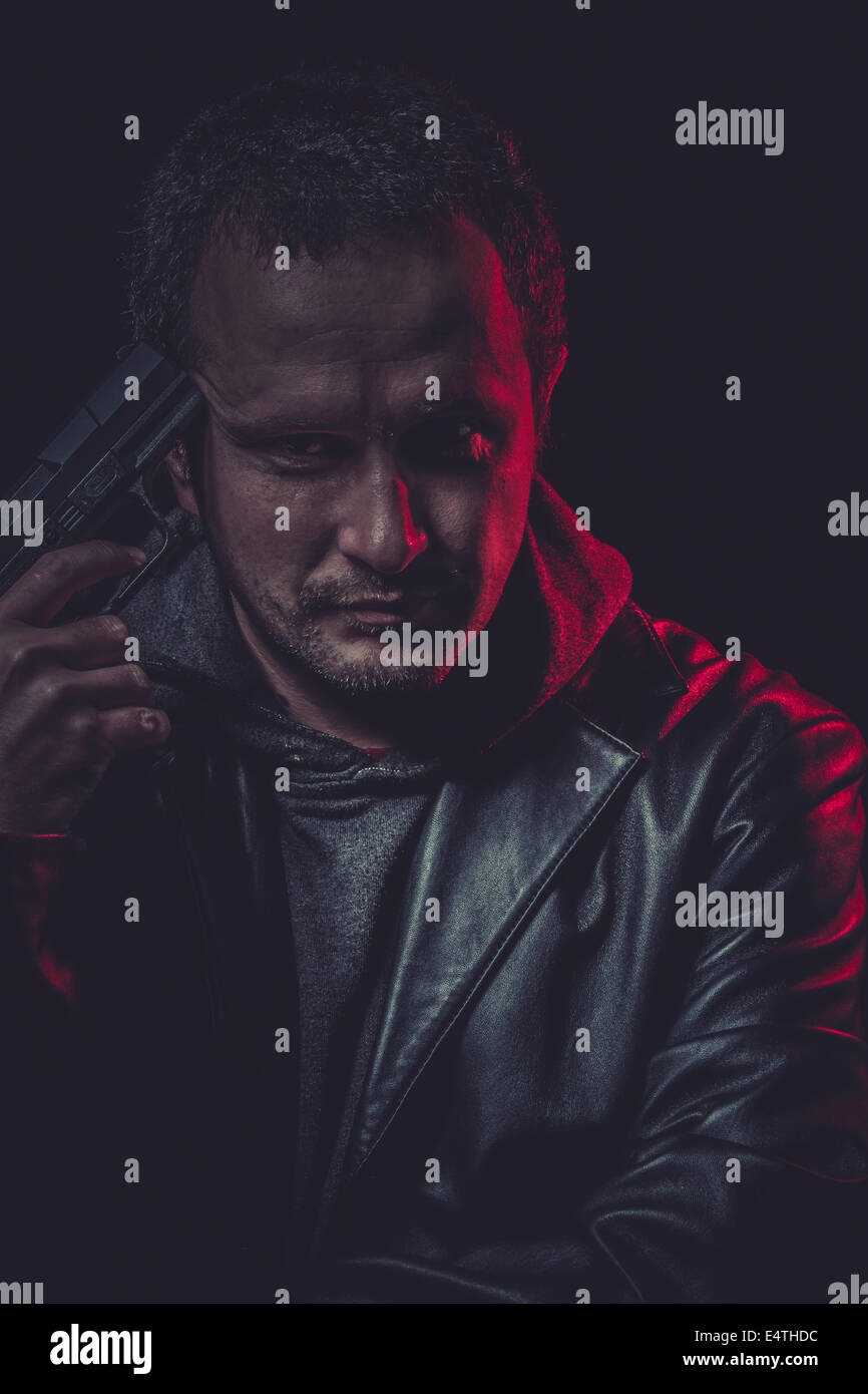 secret agent with gun and red light Stock Photo - Alamy