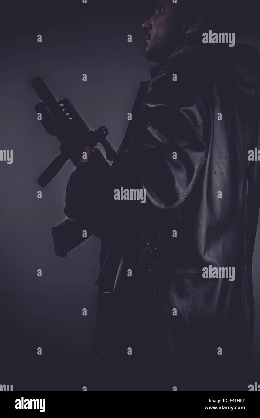 spy, portrait of murderer with gun Stock Photo - Alamy