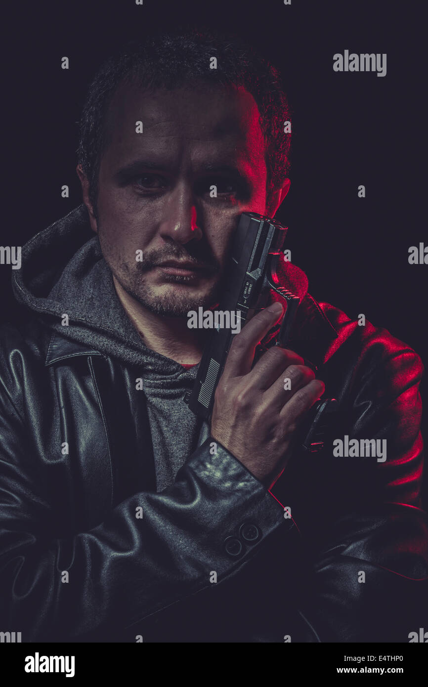Weapon, secret agent with gun and red light Stock Photo - Alamy