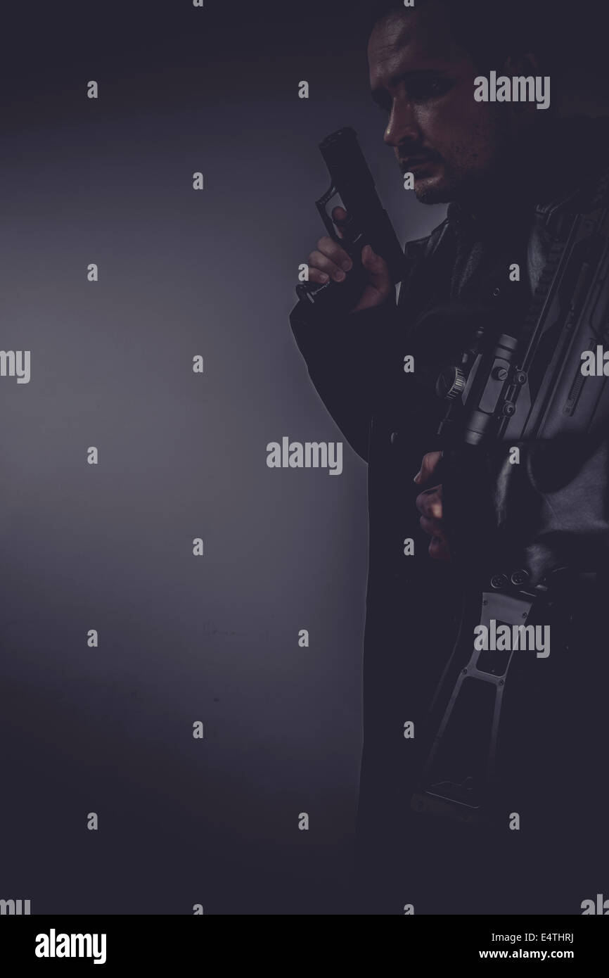 Criminal, portrait of murderer with gun Stock Photo - Alamy