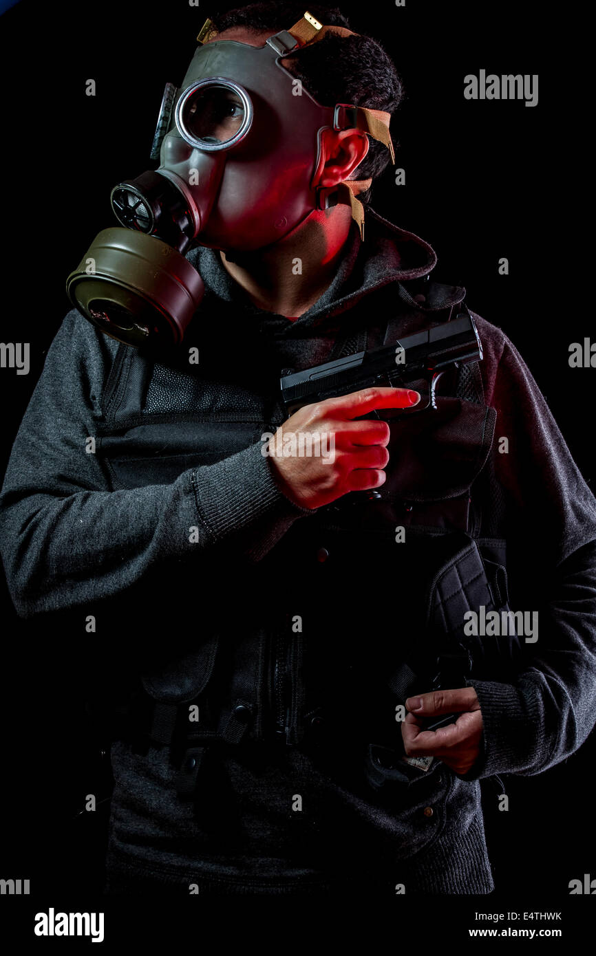 Private detective with bulletproof vest and gas mask, toxic Stock Photo ...