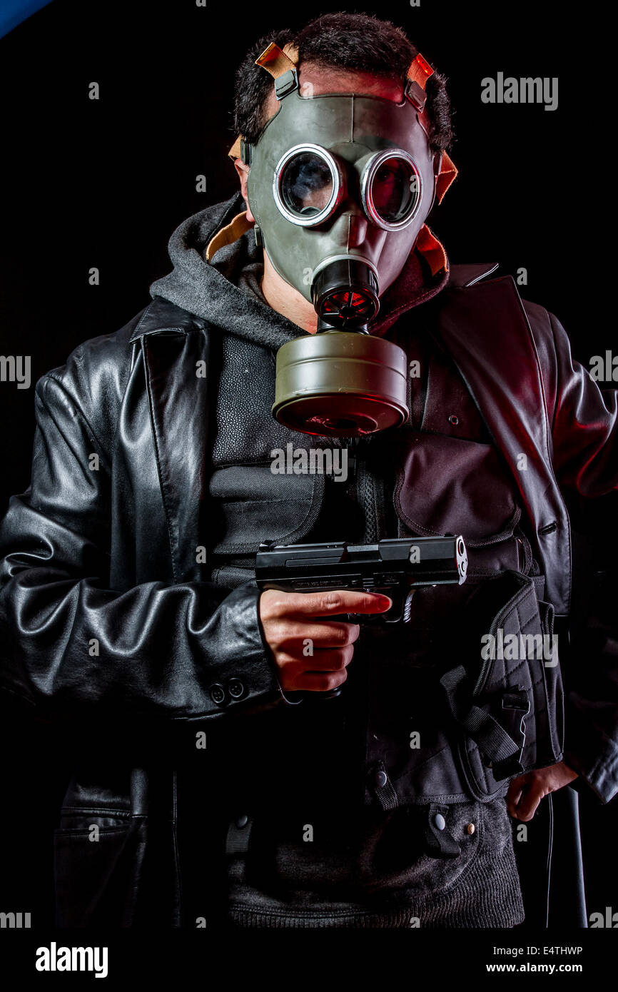 Private detective with bulletproof vest and gas mask Stock Photo - Alamy