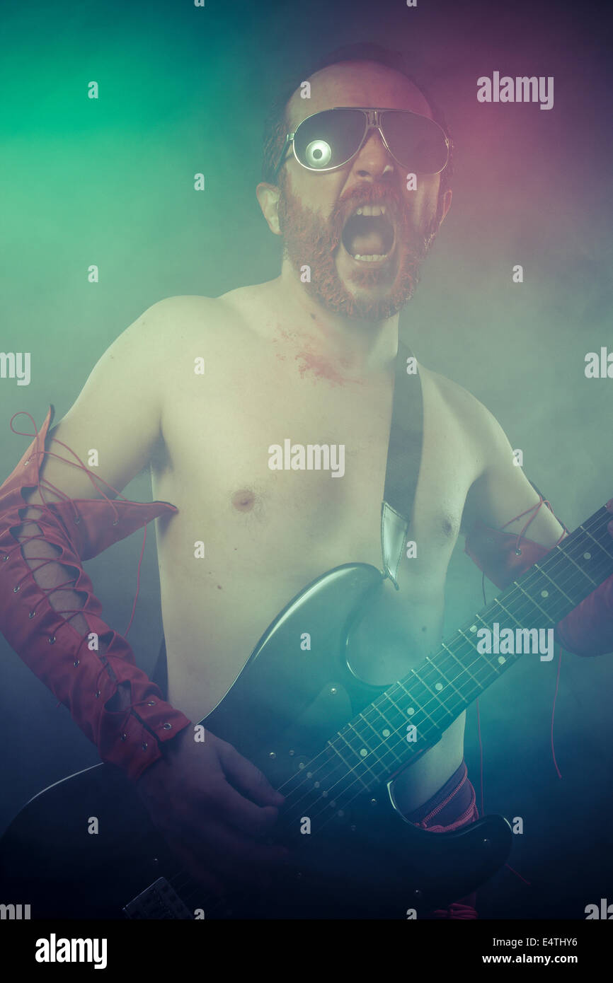 rocker man with electric guitar in a rock concert Stock Photo - Alamy
