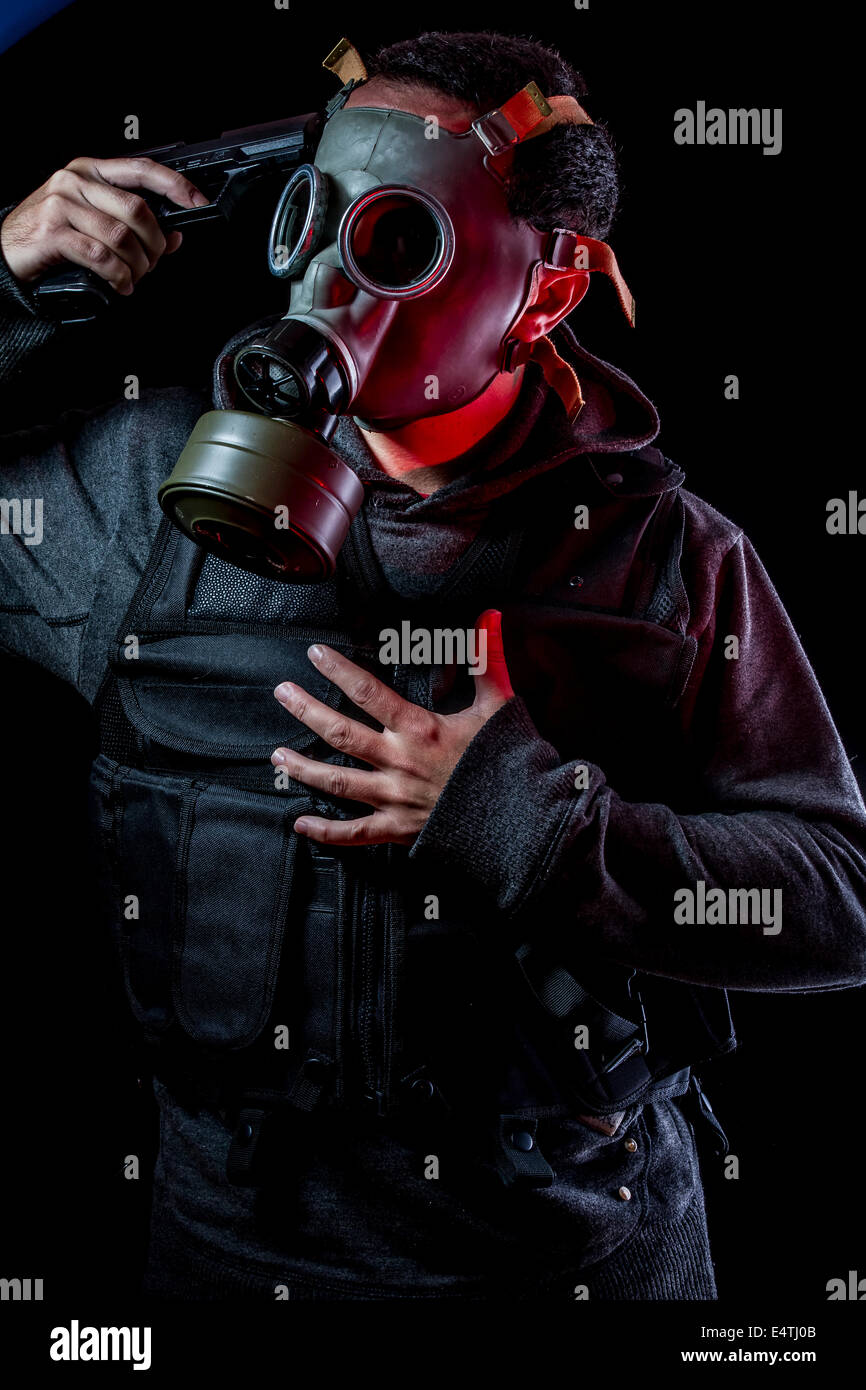 Private detective with bulletproof vest and gas mask Stock Photo - Alamy