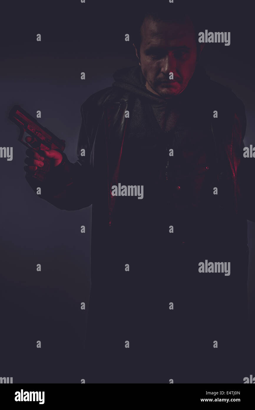 portrait of murderer with gun Stock Photo - Alamy