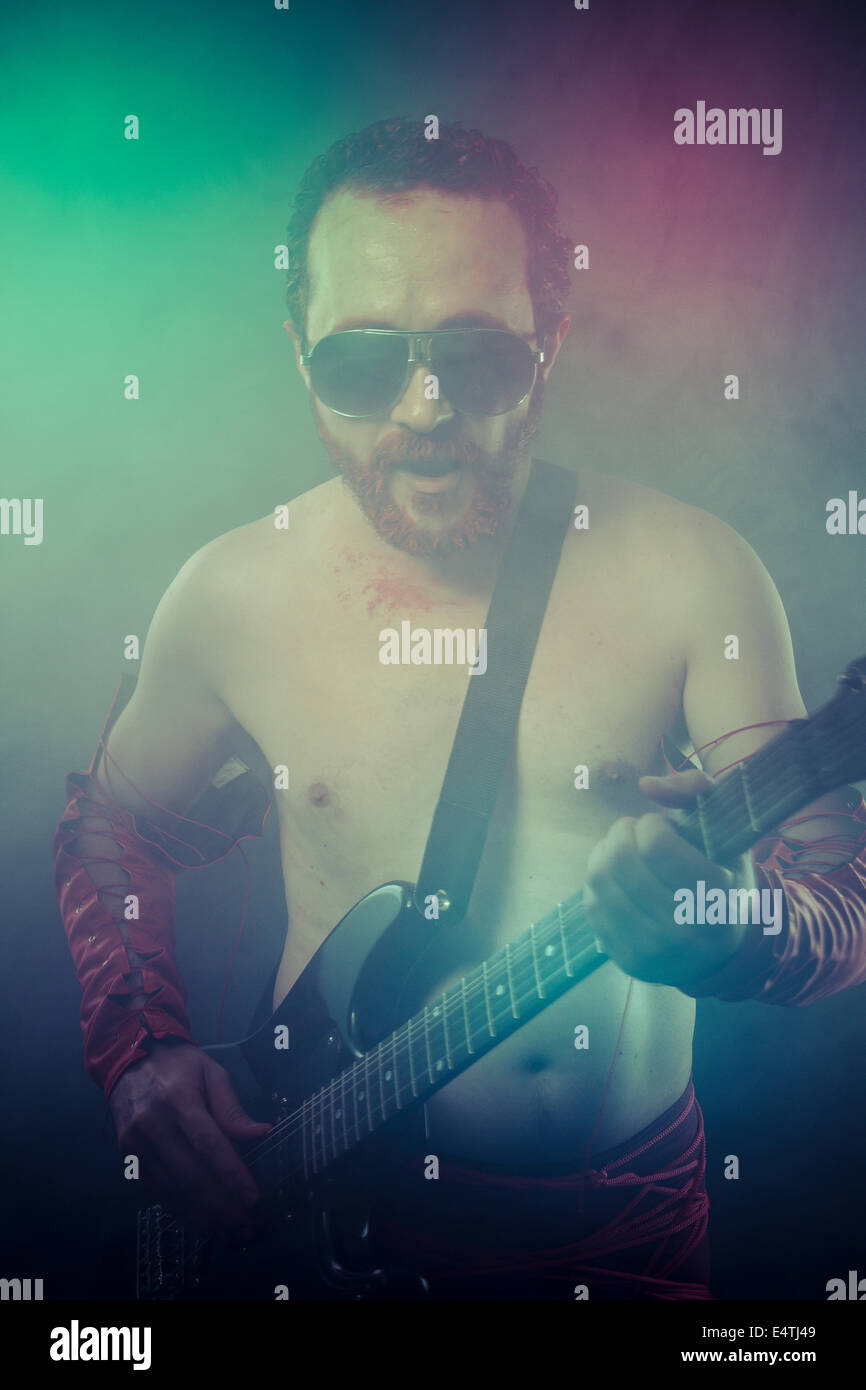 rocker man with electric guitar in a rock concert Stock Photo - Alamy